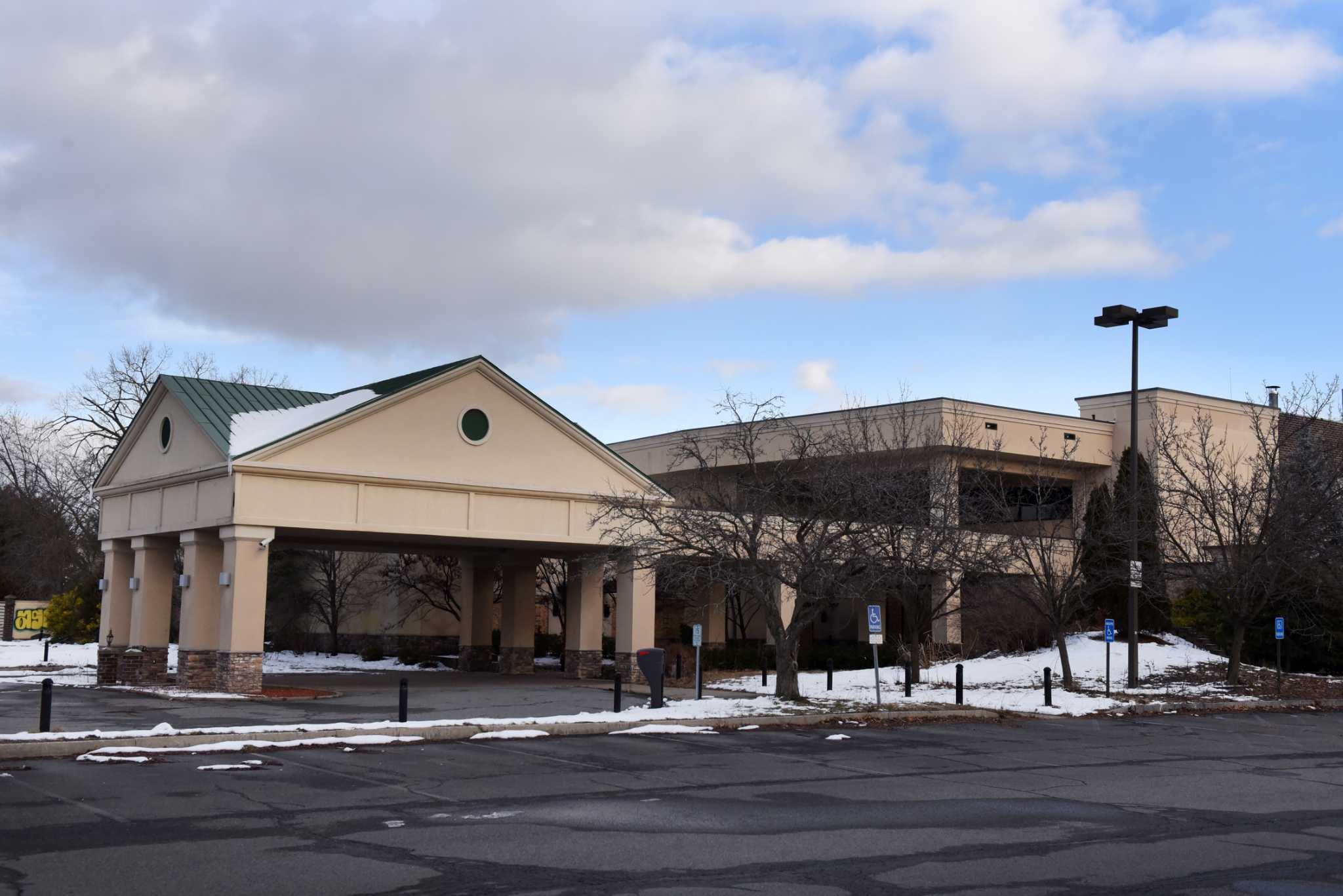 Despite new owner, former hotel at 205 Wolf Road remains vacant