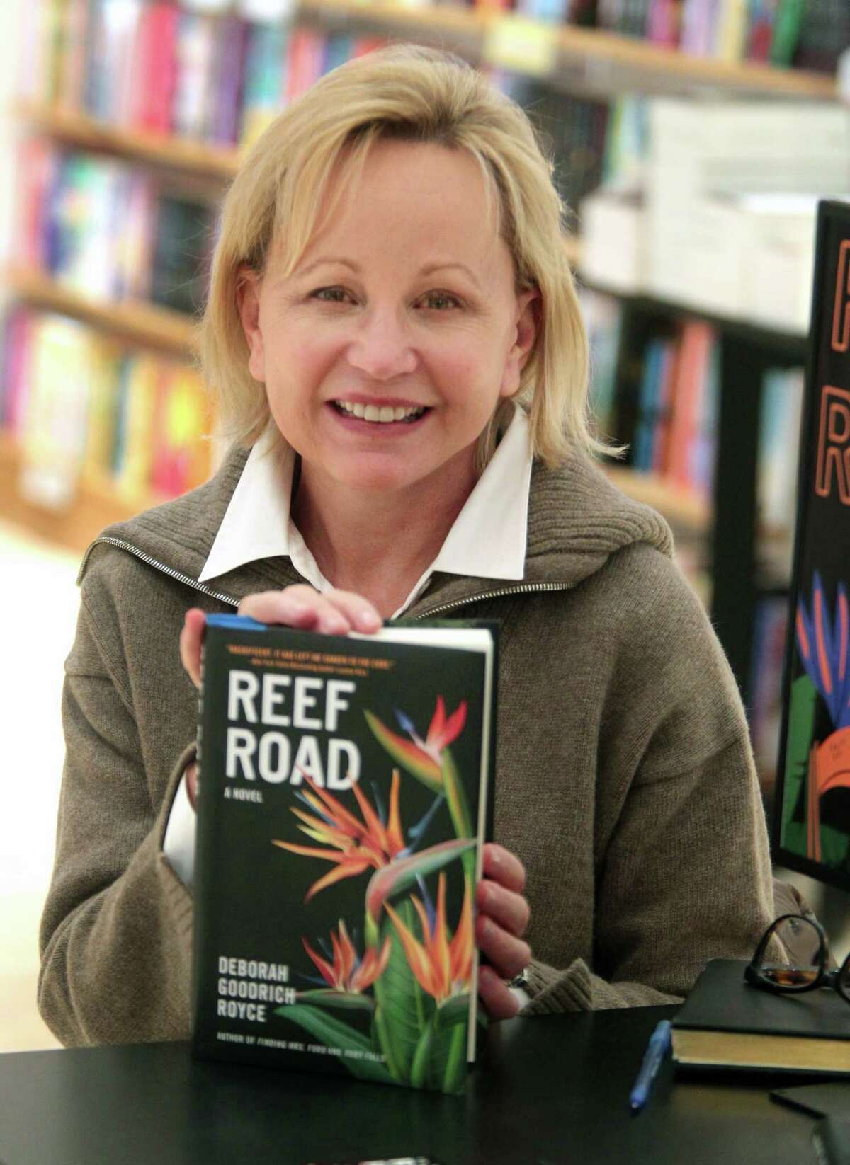 Greenwich author signs latest book at Westport store