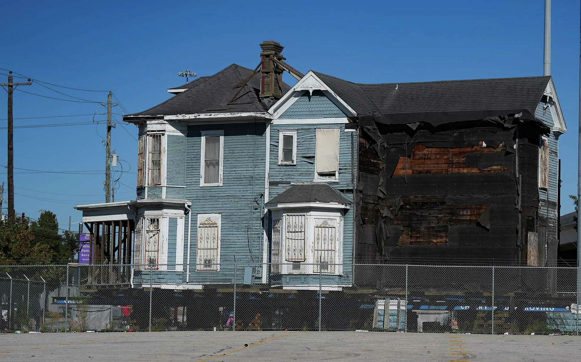 Why is the big blue Cohn house sitting in a Houston parking lot?