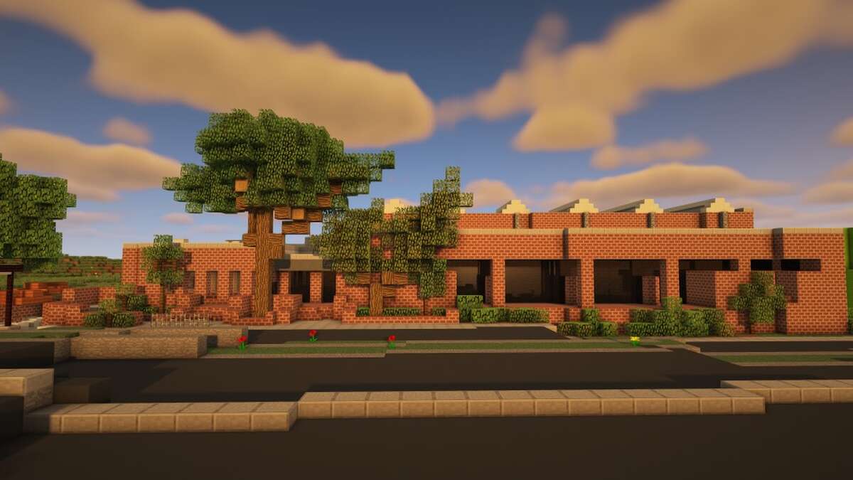 A Minecraft player is building Trinity University, block by block