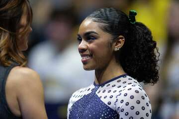 eMjae Frazier leads Cal gymnastics to tie with UCLA, sister Margzetta