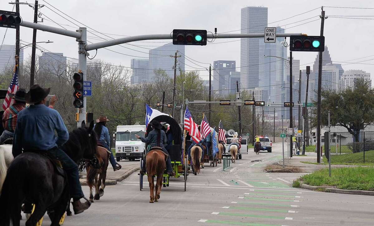 Houston rodeo trail ride: Riders reach downtown Houston rodeo parade