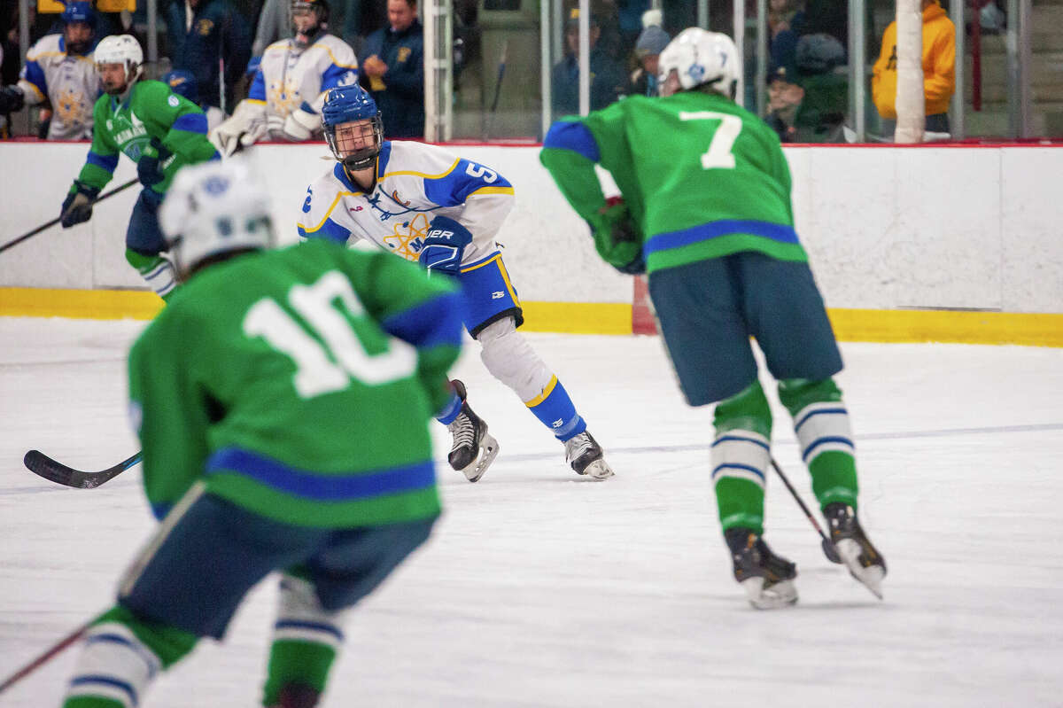 PHOTOS: Midland and Saginaw Heritage high schools clash in hockey regi