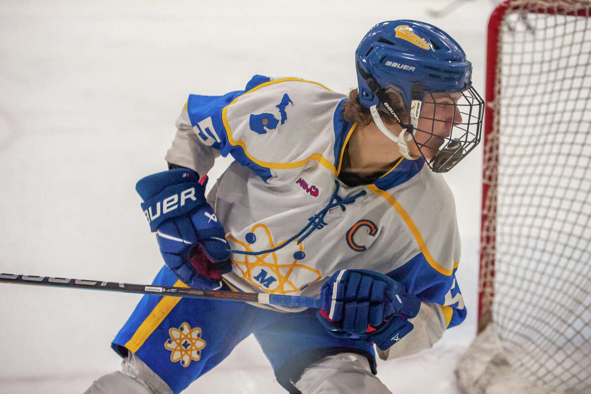 PHOTOS: Midland and Saginaw Heritage high schools clash in hockey regi