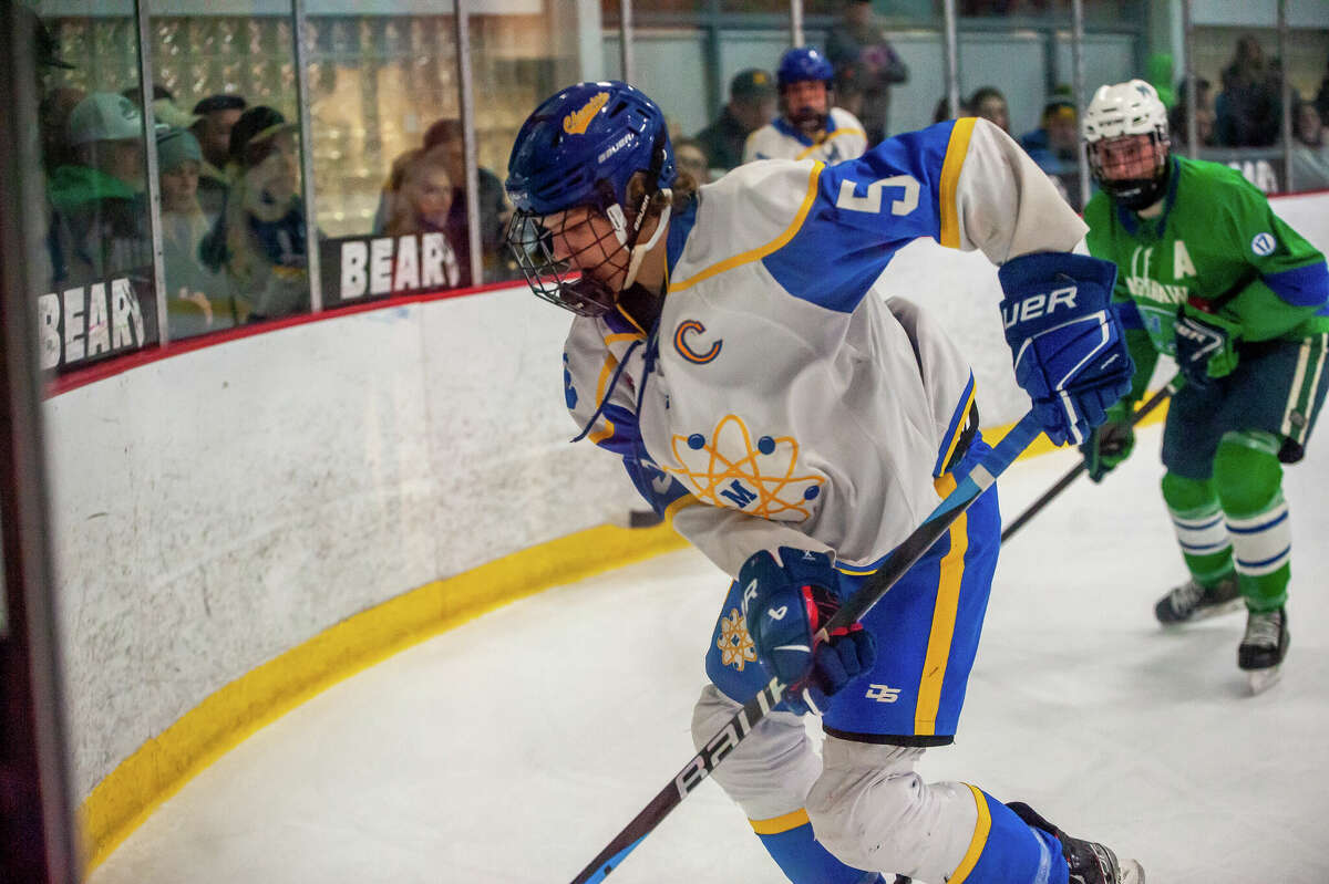 PHOTOS: Midland and Saginaw Heritage high schools clash in hockey regi