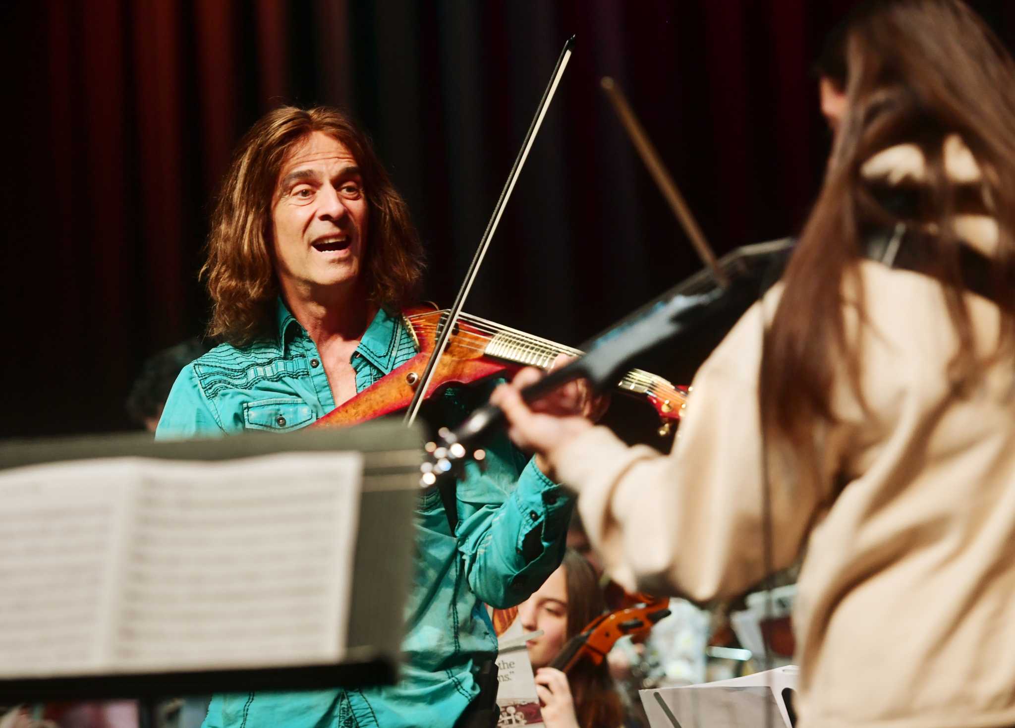 Trans-Siberian Orchestra musician works with Milford students