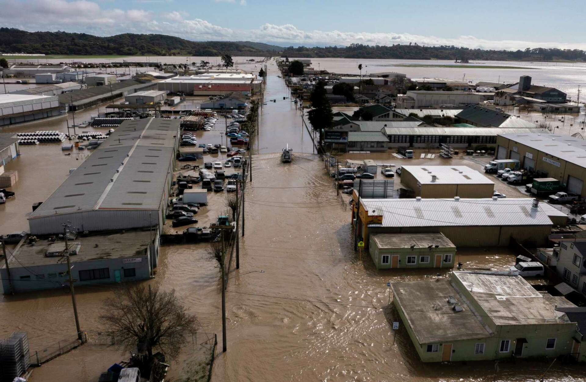See drone video of Pajaro flowing through levee, devastating flooding