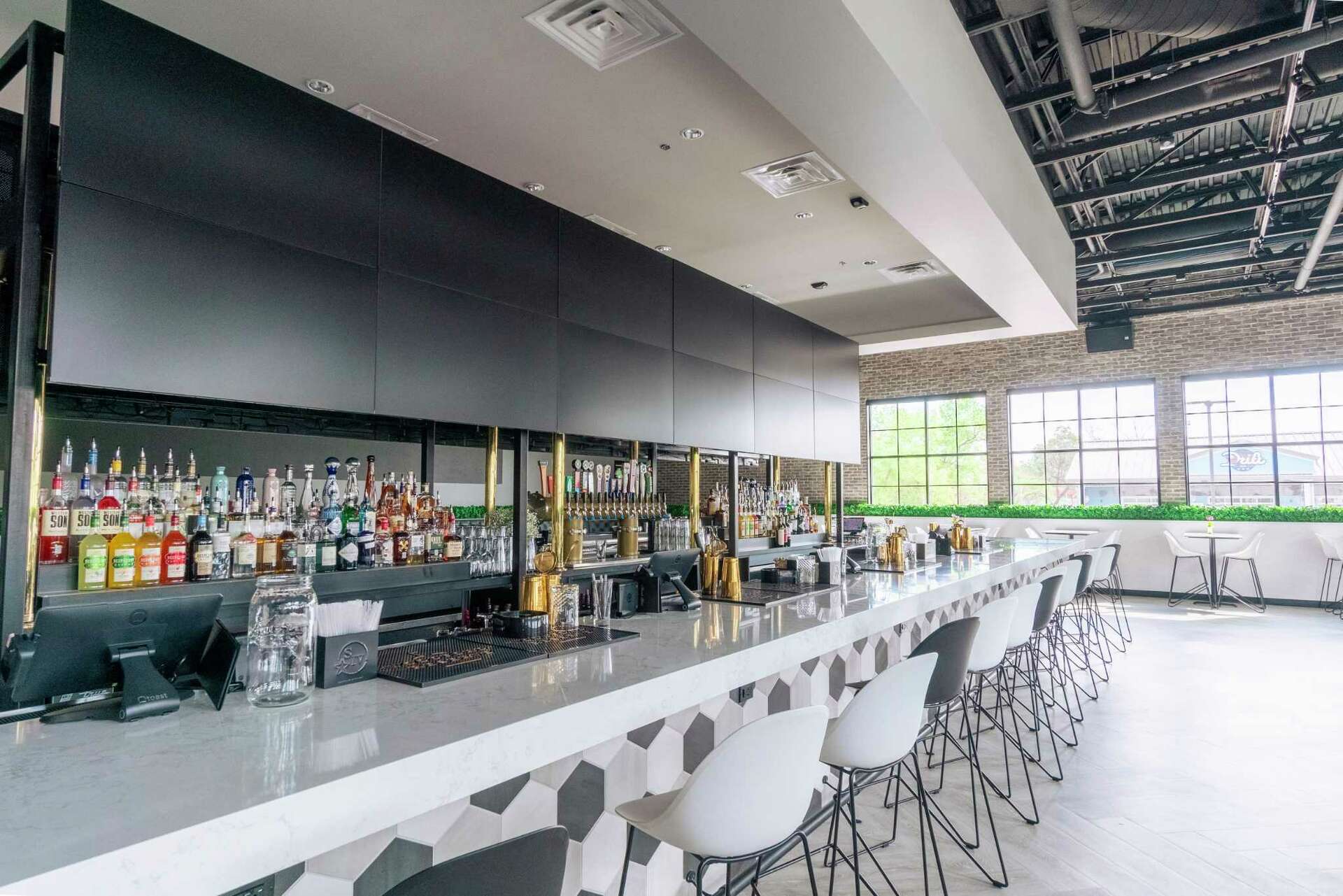 Upscale bar with posh design and cocktails on tap opens in Heights