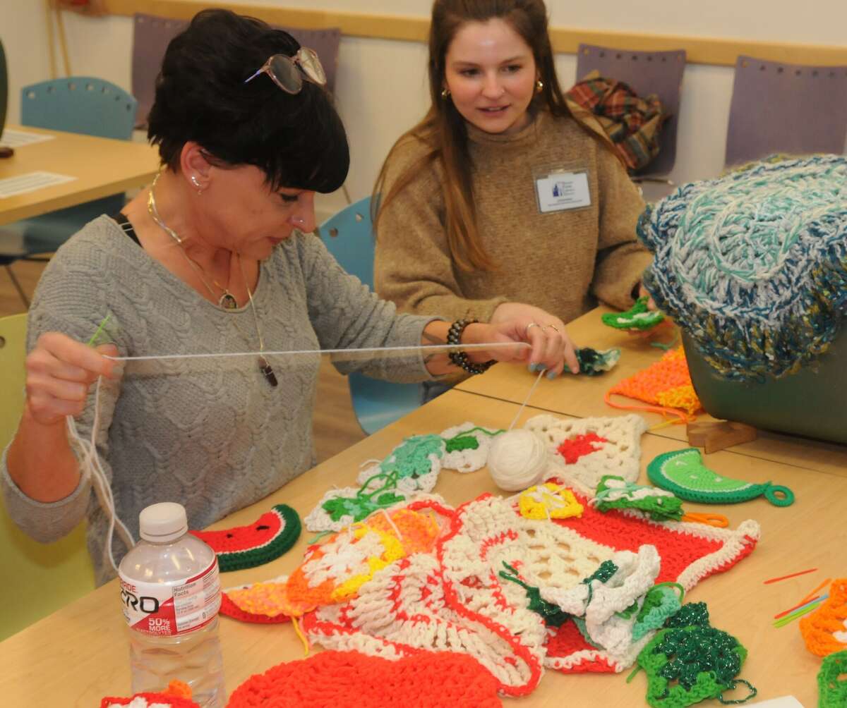 Yarn bombers brighten Alton library with Saturday mall effort