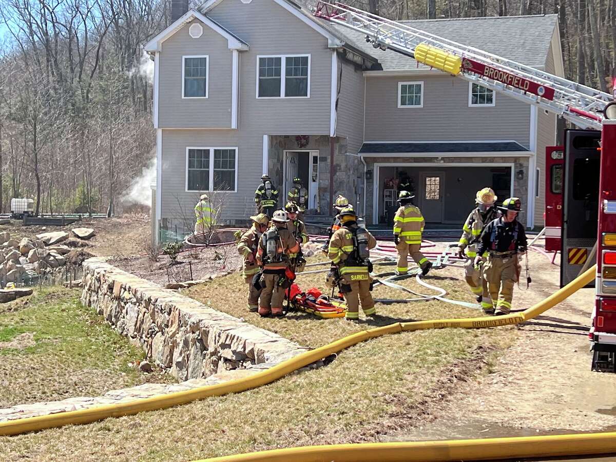 Firefighter taken to hospital after battling Brookfield blaze