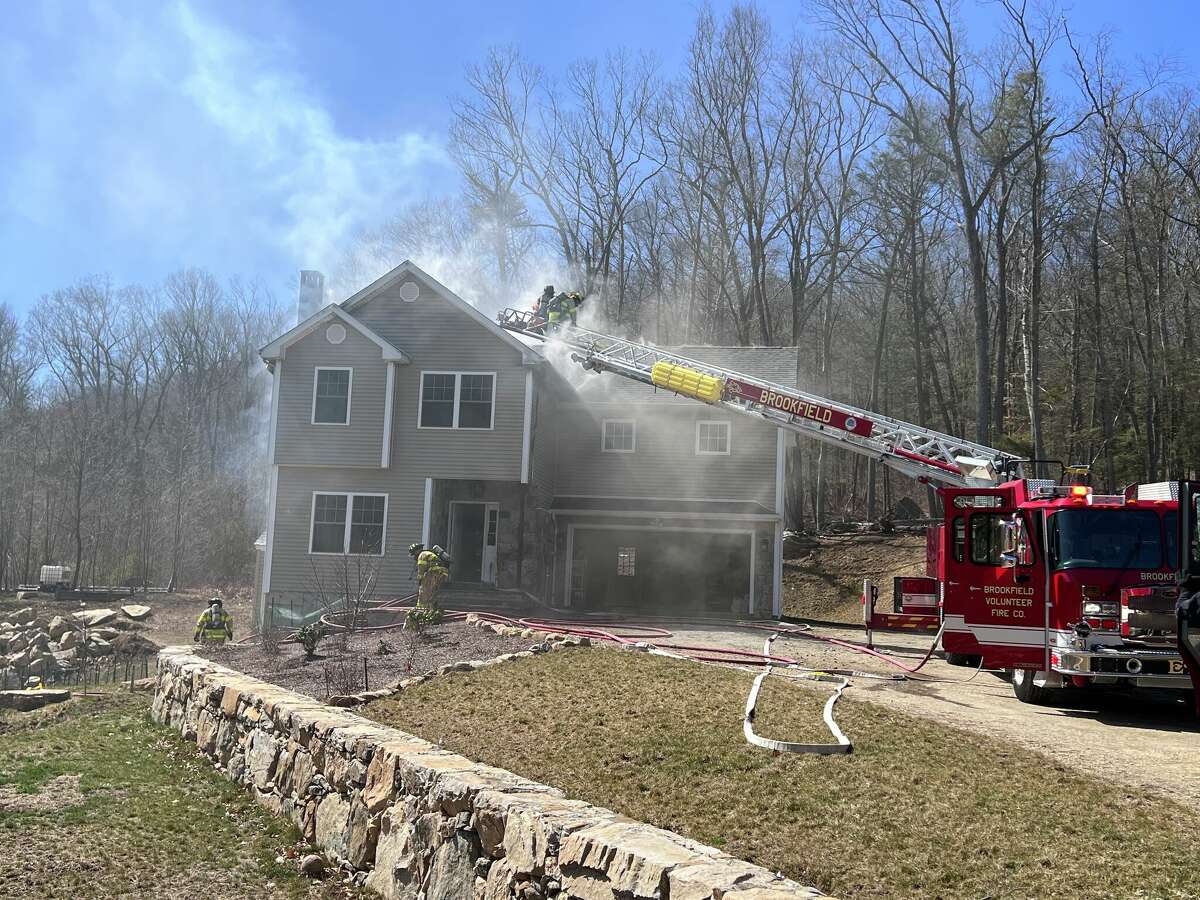 Firefighter taken to hospital after battling Brookfield blaze