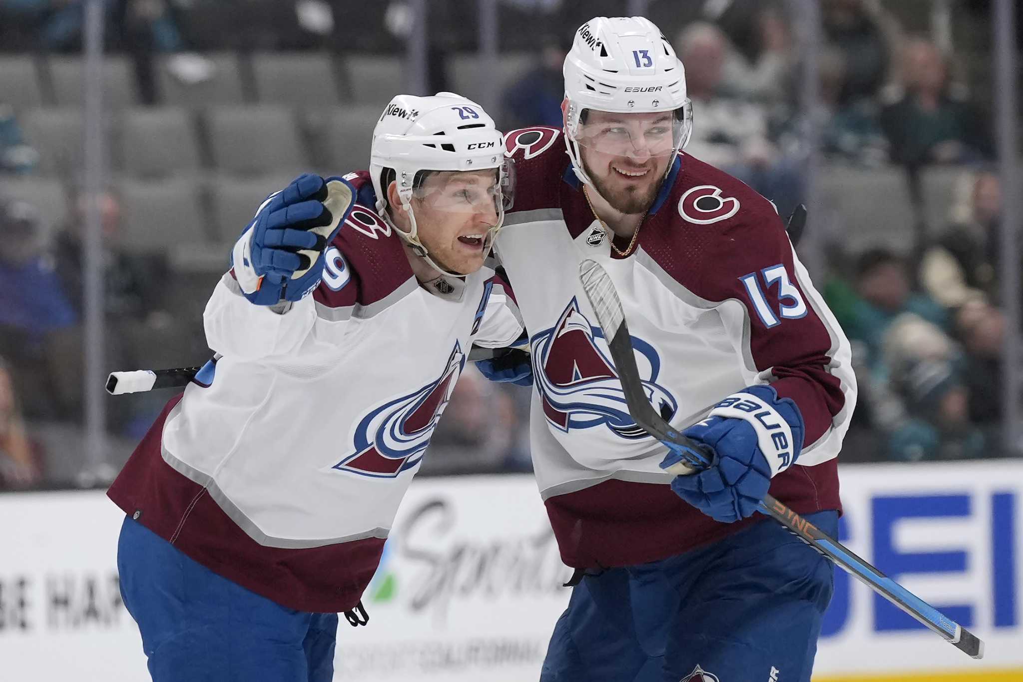 MacKinnon scores 2, leads Avalanche past Sharks 4-3 in OT