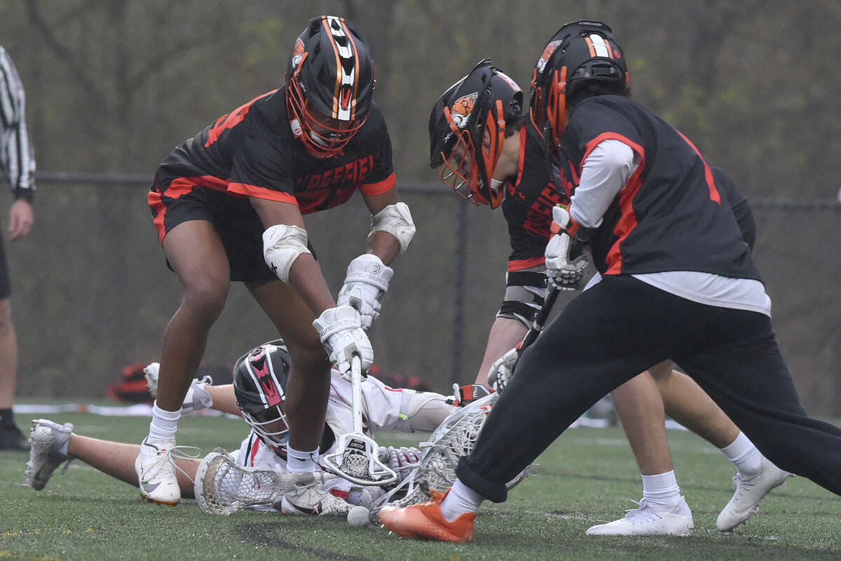 New Canaan boys lacrosse defeated Ridgefield at Dunning Field.