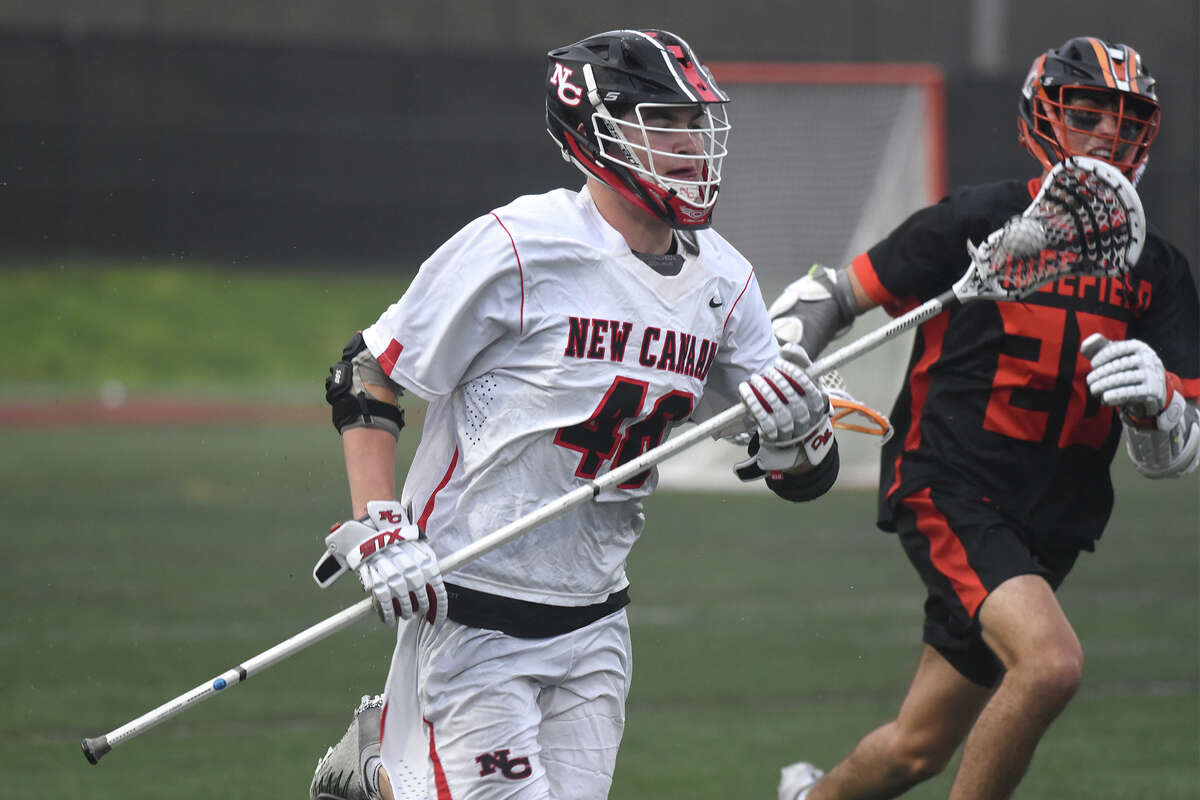 New Canaan boys lacrosse defeated Ridgefield at Dunning Field.