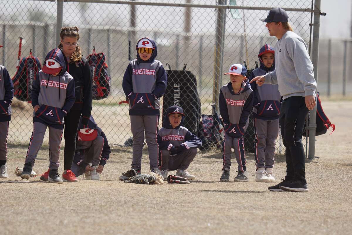 Brian Klein spends time with Plainview Avenged 9u players