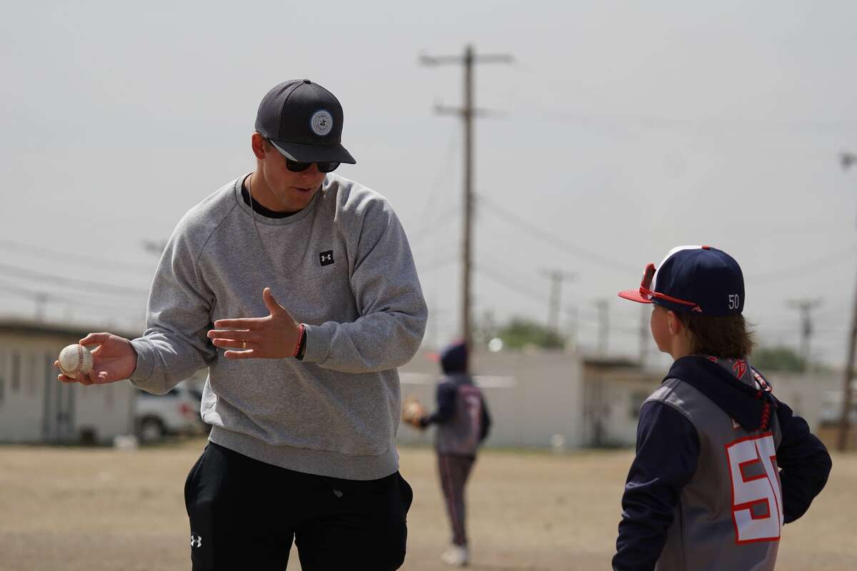 Brian Klein spends time with Plainview Avenged 9u players