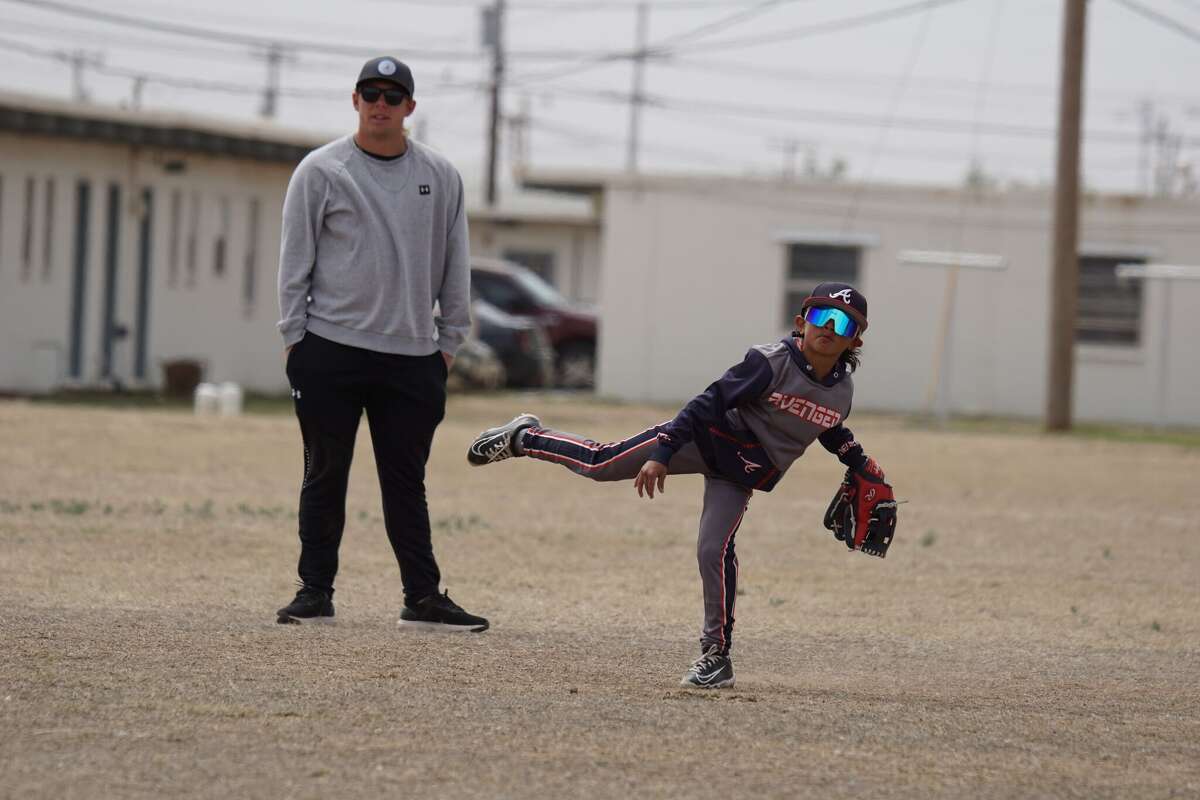 Brian Klein spends time with Plainview Avenged 9u players