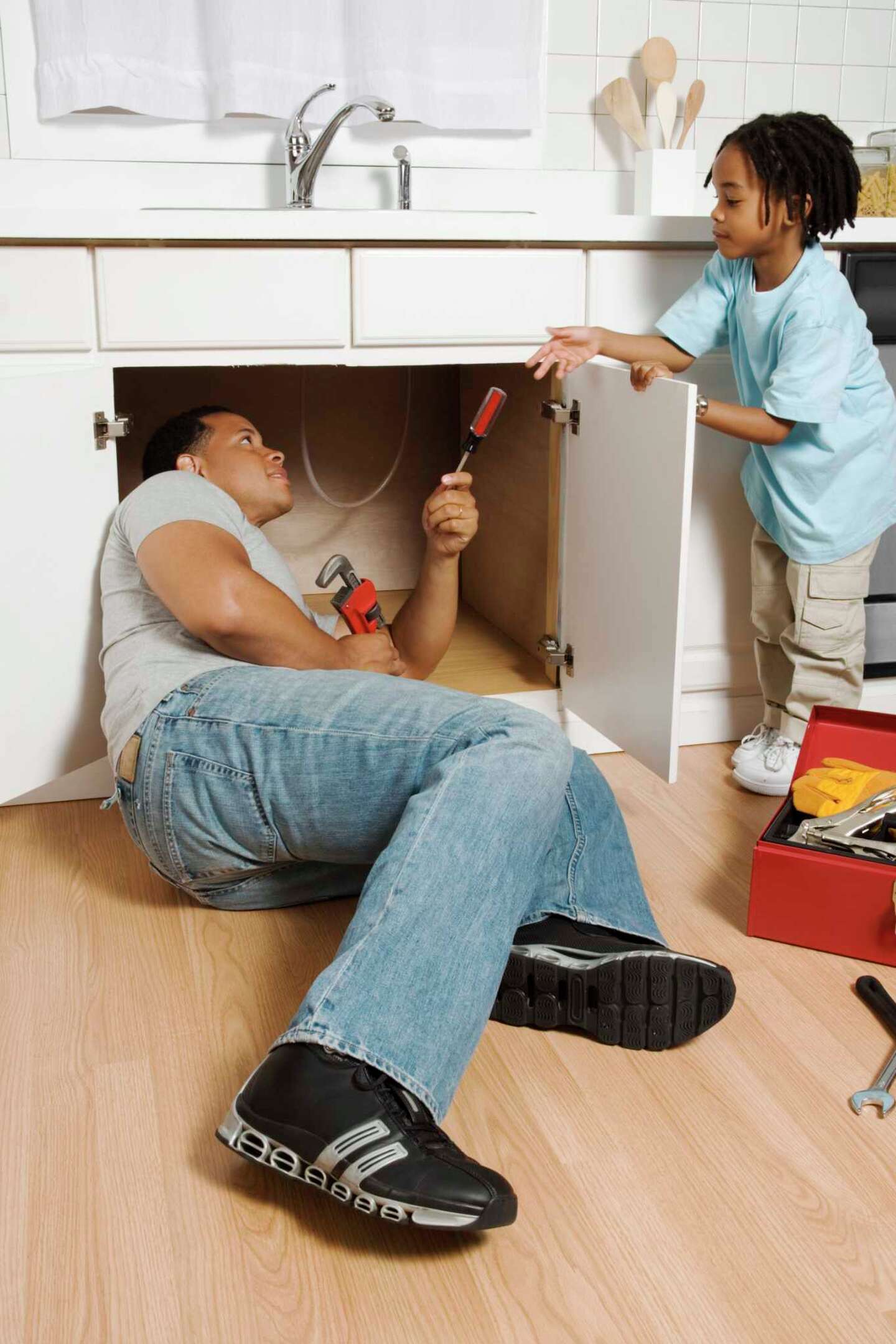 How to Run a Flexible Water Line Through Kitchen Cabinets