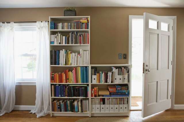 How to Repurpose a Bookcase by Turning It on Its Side for Vertical Storage