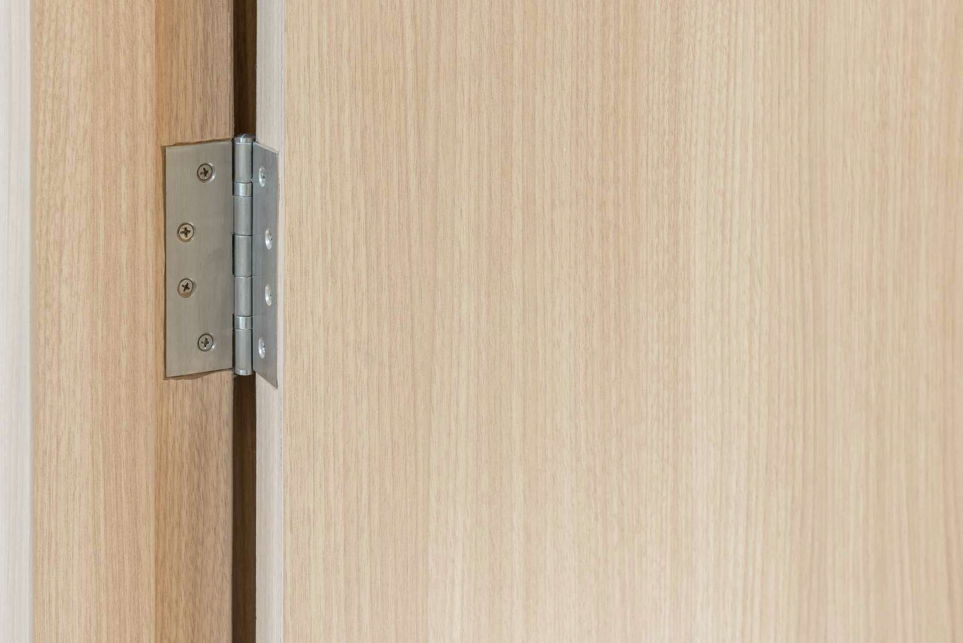 How to Determine Hinge Spacing on a Door