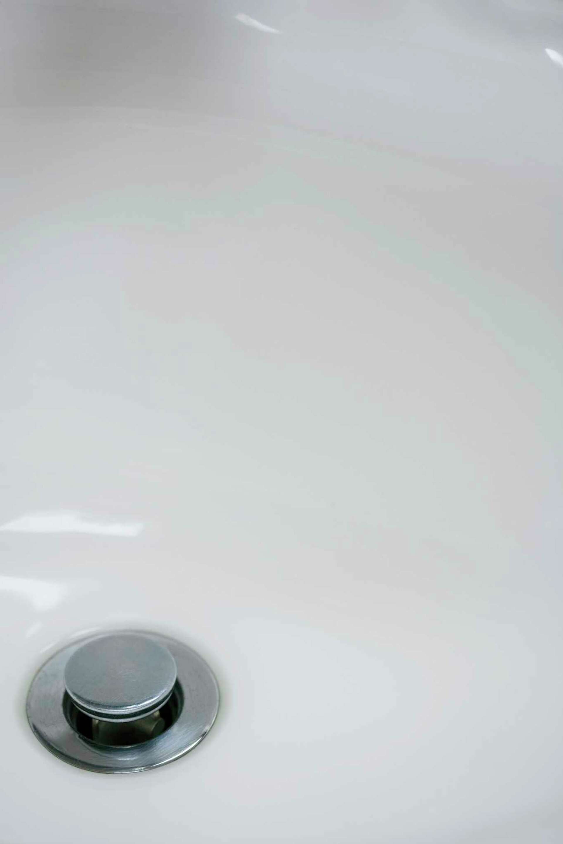 How to Replace a Chrome Foot Lock Stopper in the Bottom of a Tub