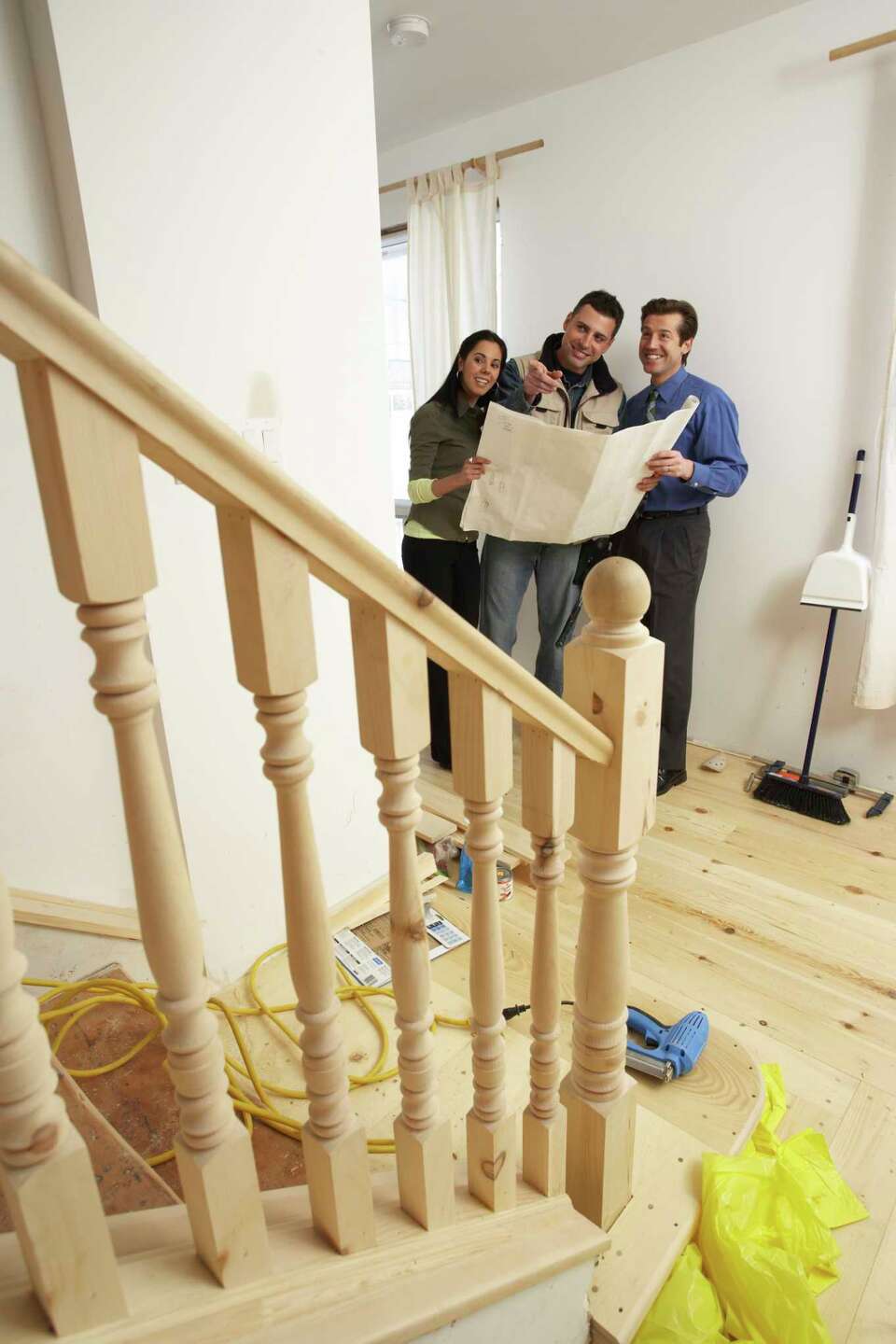 How to Attach a Post to Stairs With a Bracket