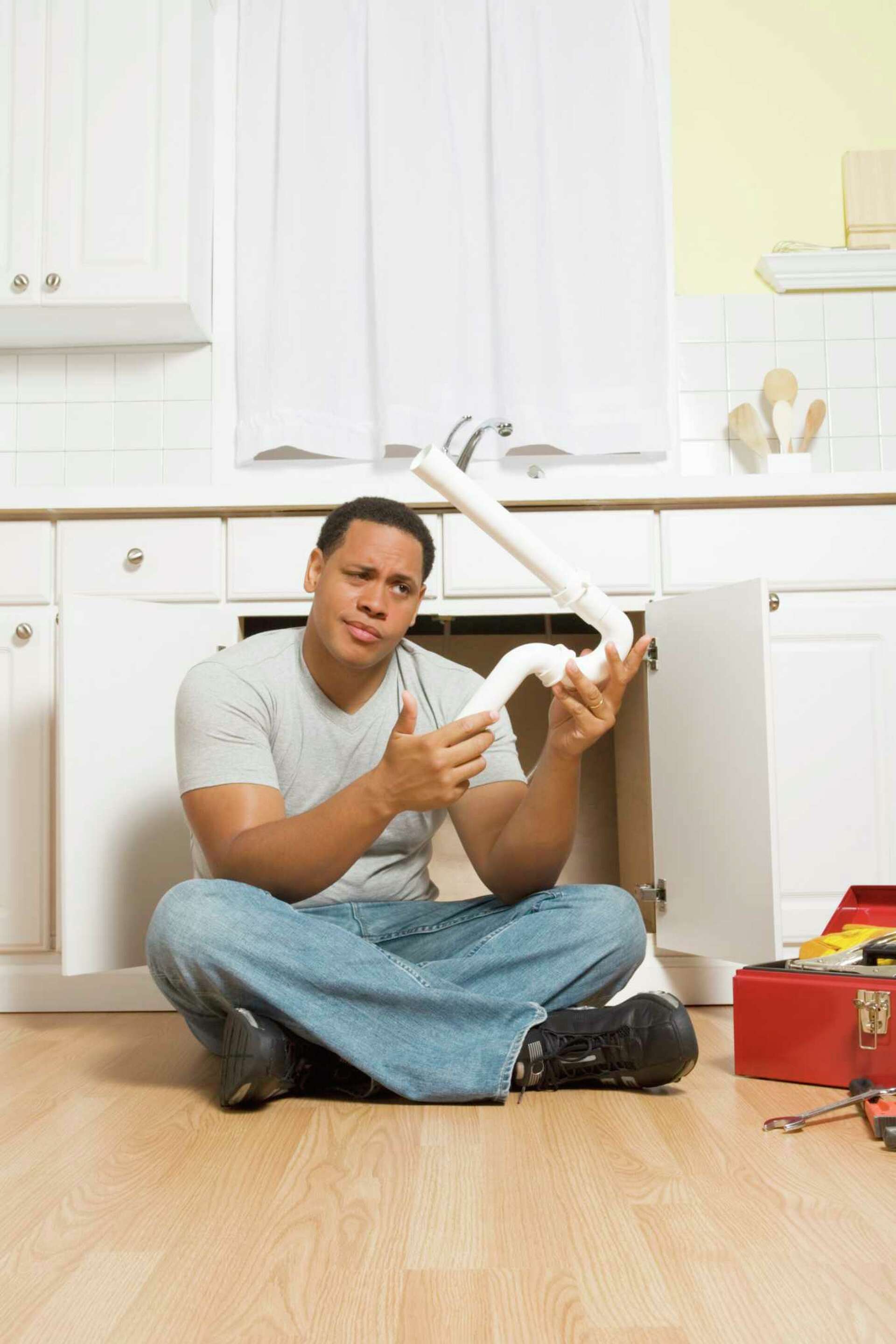 How to Fix a J-Trap Underneath a Kitchen Sink