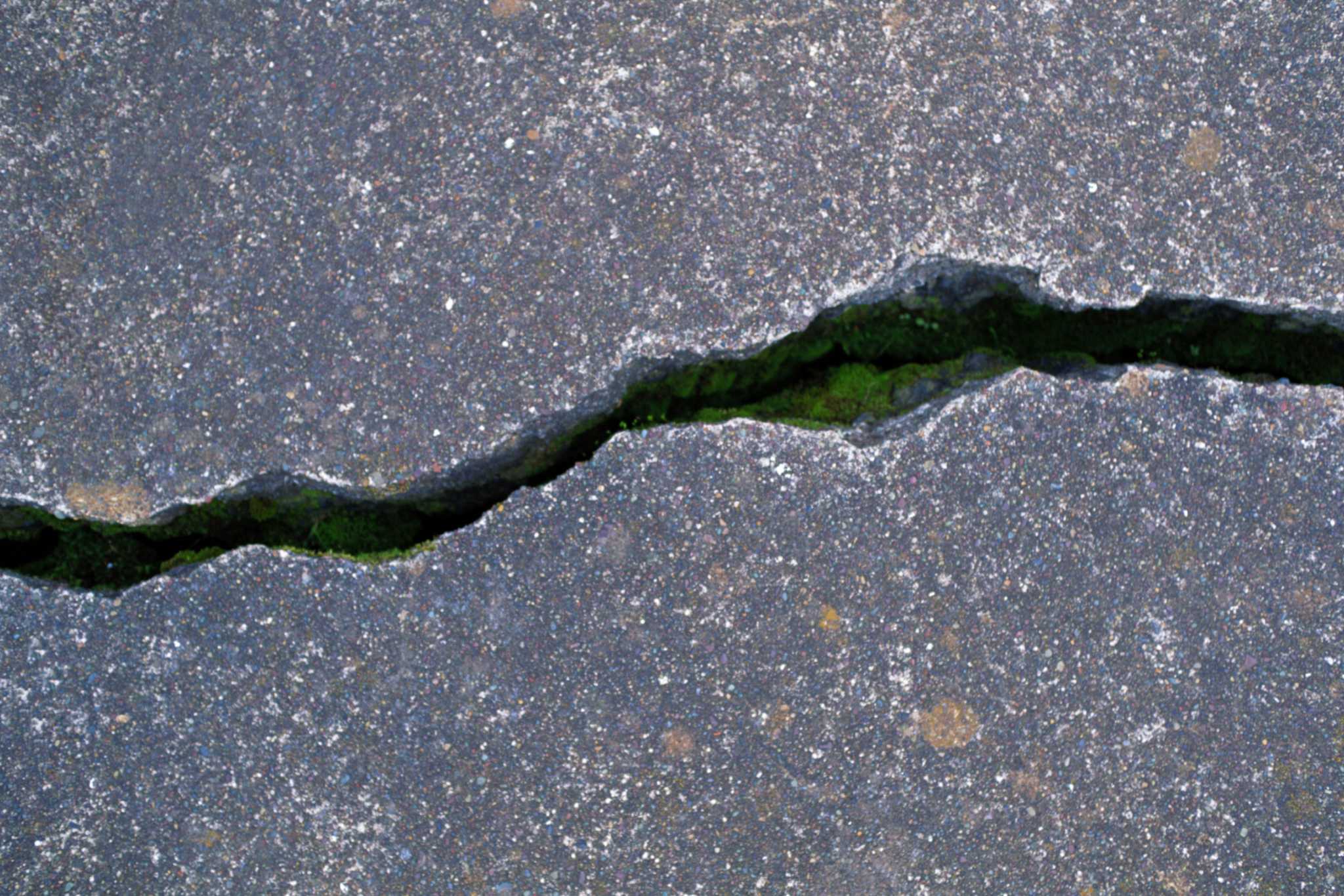 How to Repair a Cracked and Uneven Cement Pad