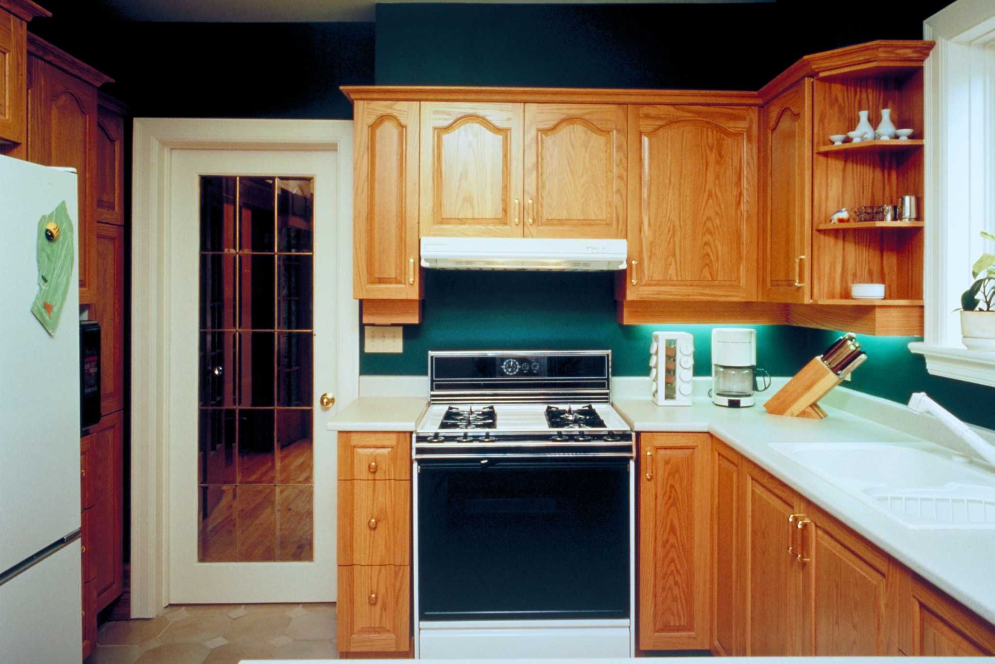 What Causes Discoloration of the Finish on Kitchen Cabinets?
