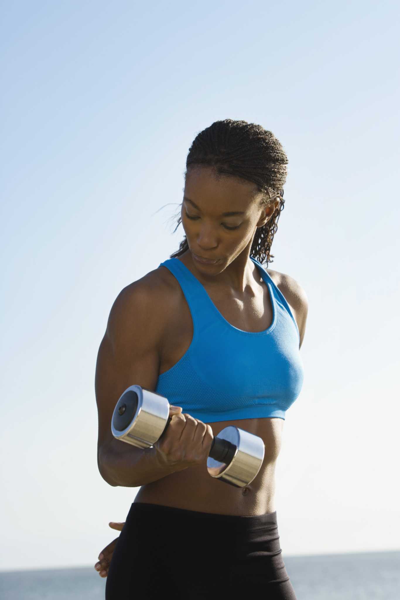 What Is the Triceps Muscle Doing During a Biceps Curl?