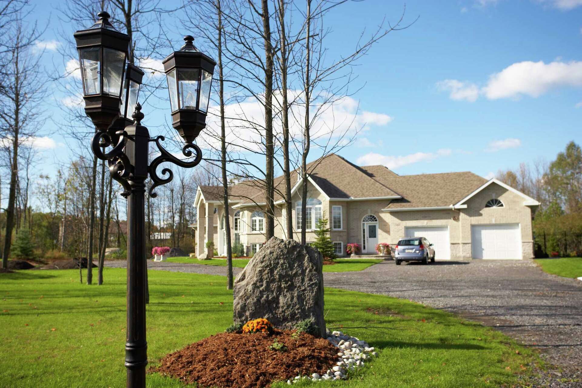 How to Install a Lamp Post With Anchor Bolts in Concrete