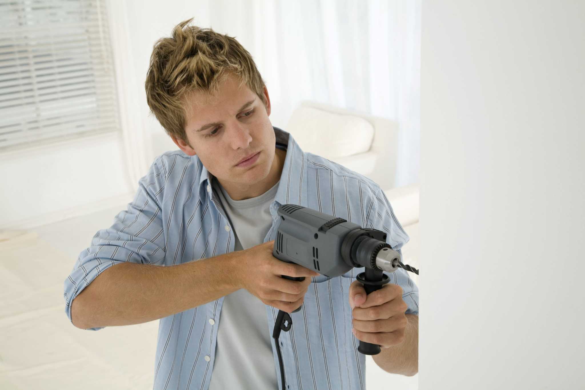 How to Install a Screw Eye Into a Plaster Wall
