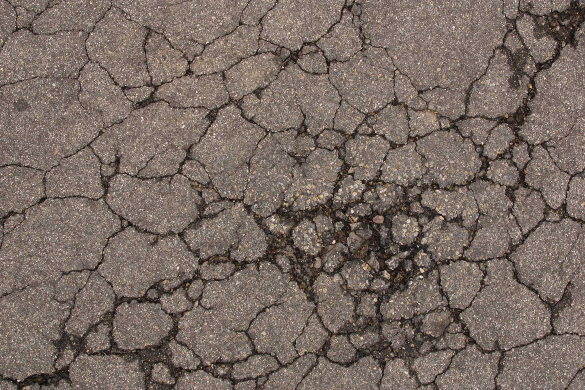 How to Repair a Driveway Using Premix