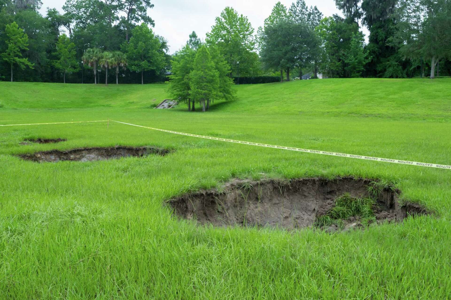 How to Repair Sinkholes in the Backyard