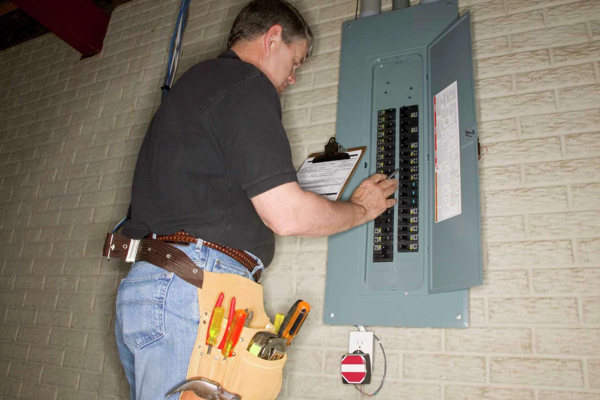 How to Run Wire Through the Studs Behind a Wall