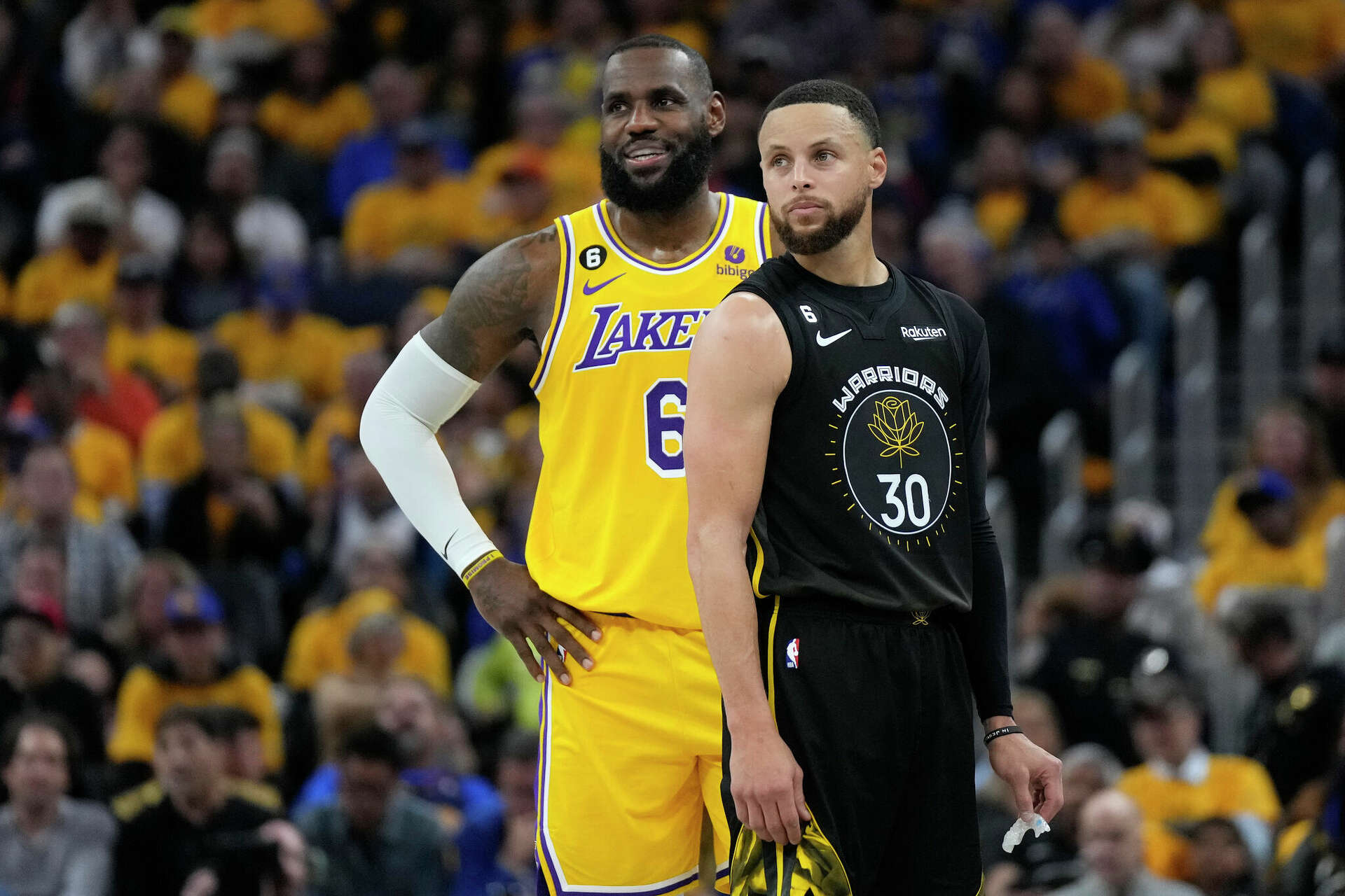 LeBron follows Steph Curry back to Warriors bench in weird moment