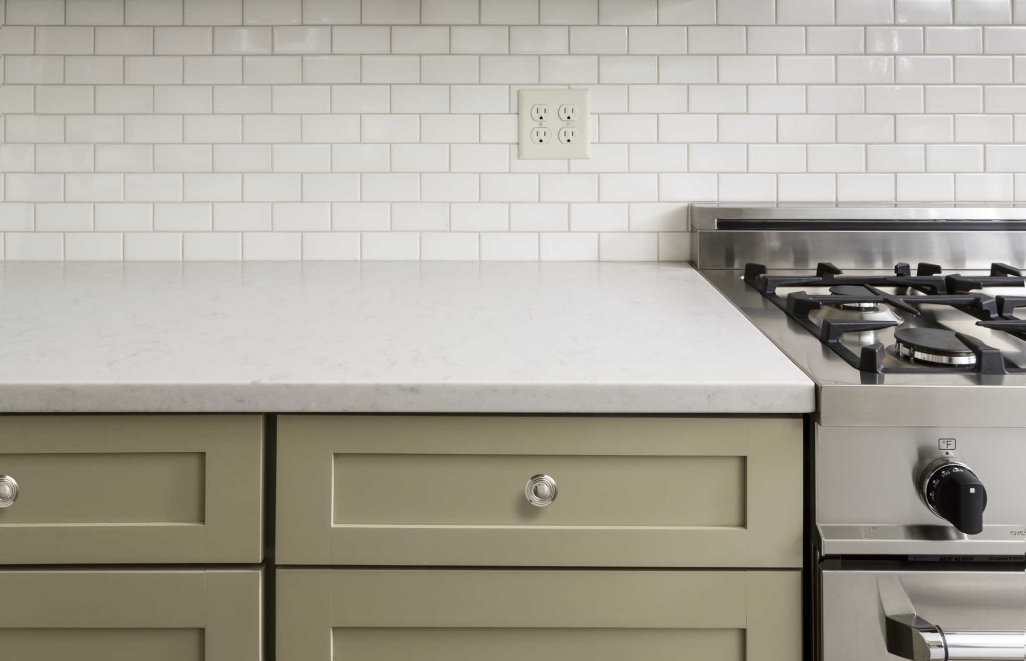 How to Put Up a Tile Backsplash Around Plugs in Ceramic Tile