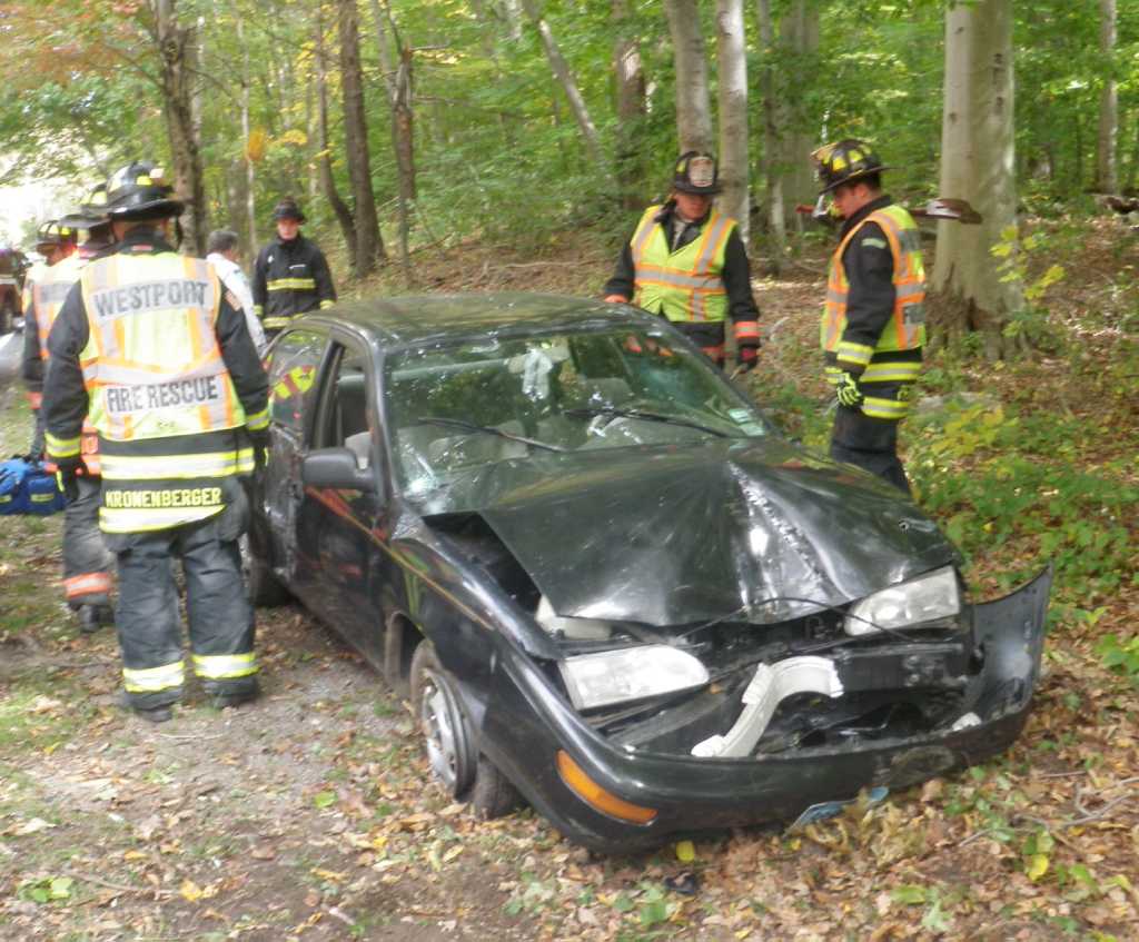 Woman hurt as car hits tree off Merritt in Westport