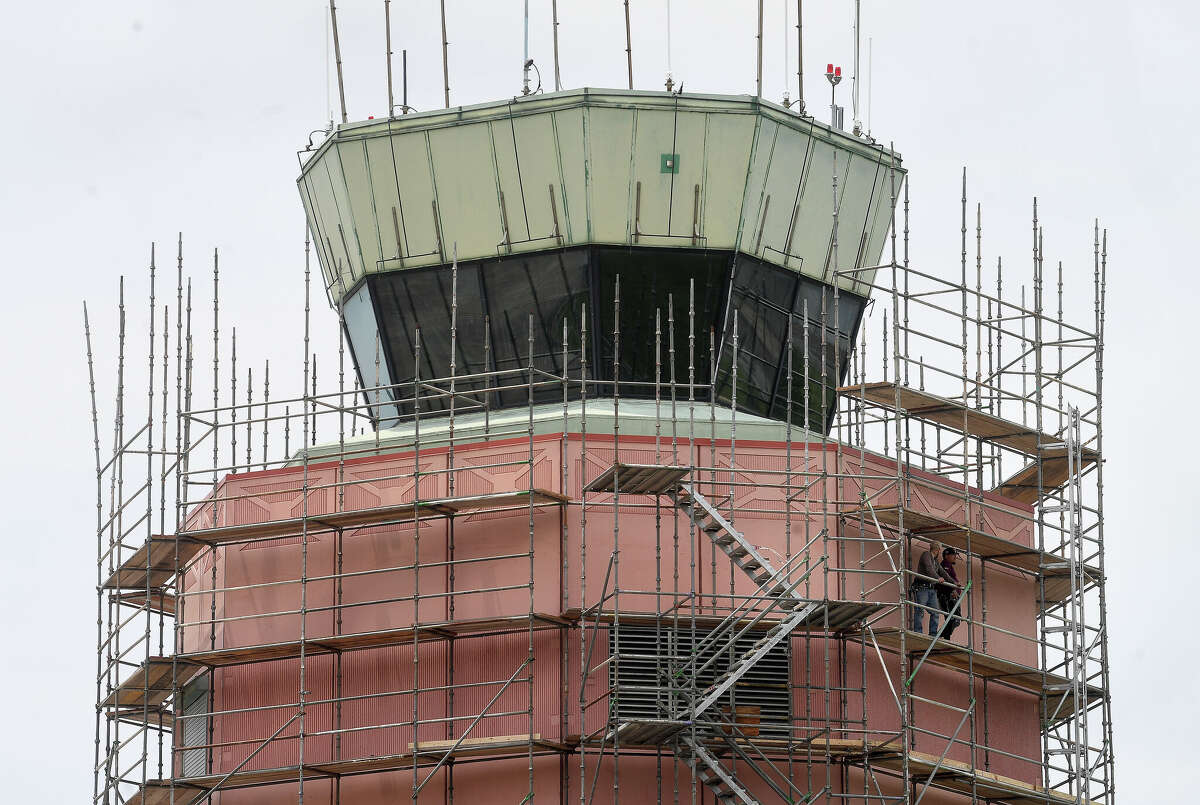 Scaffolding covers Jack Brooks air control tower for renovations