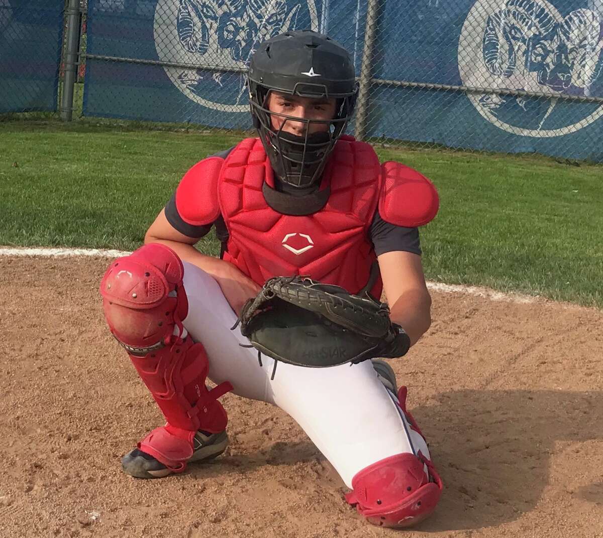Old Saybrook's Connor Lane, a UConn commit, catches and pitches.