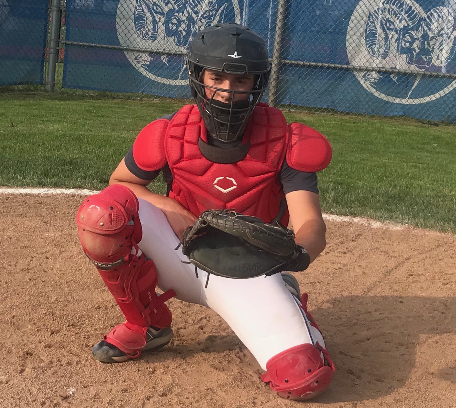 Old Saybrook's Connor Lane, a UConn commit, catches and pitches.