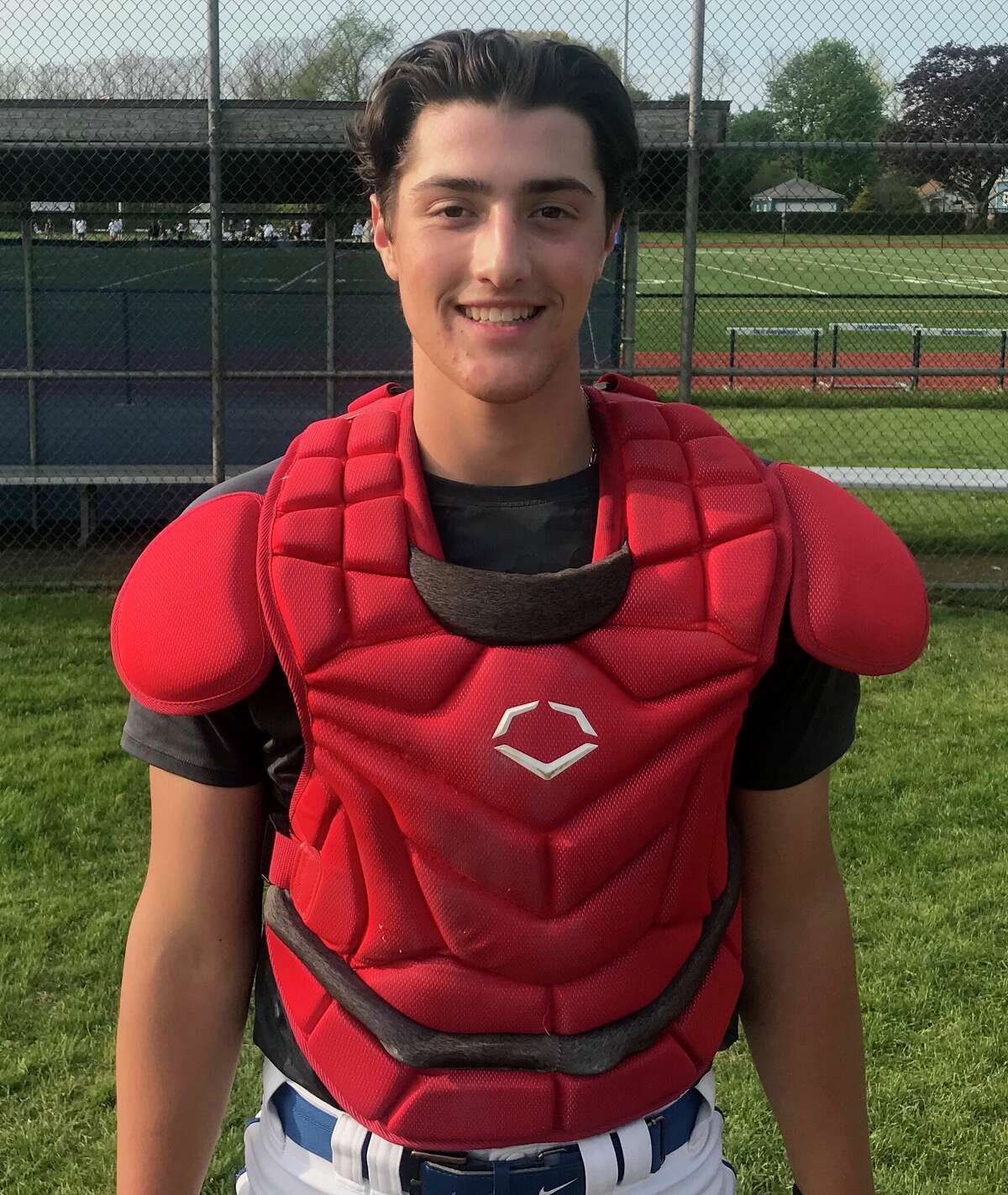 Old Saybrook's Connor Lane, a UConn commit, catches and pitches.