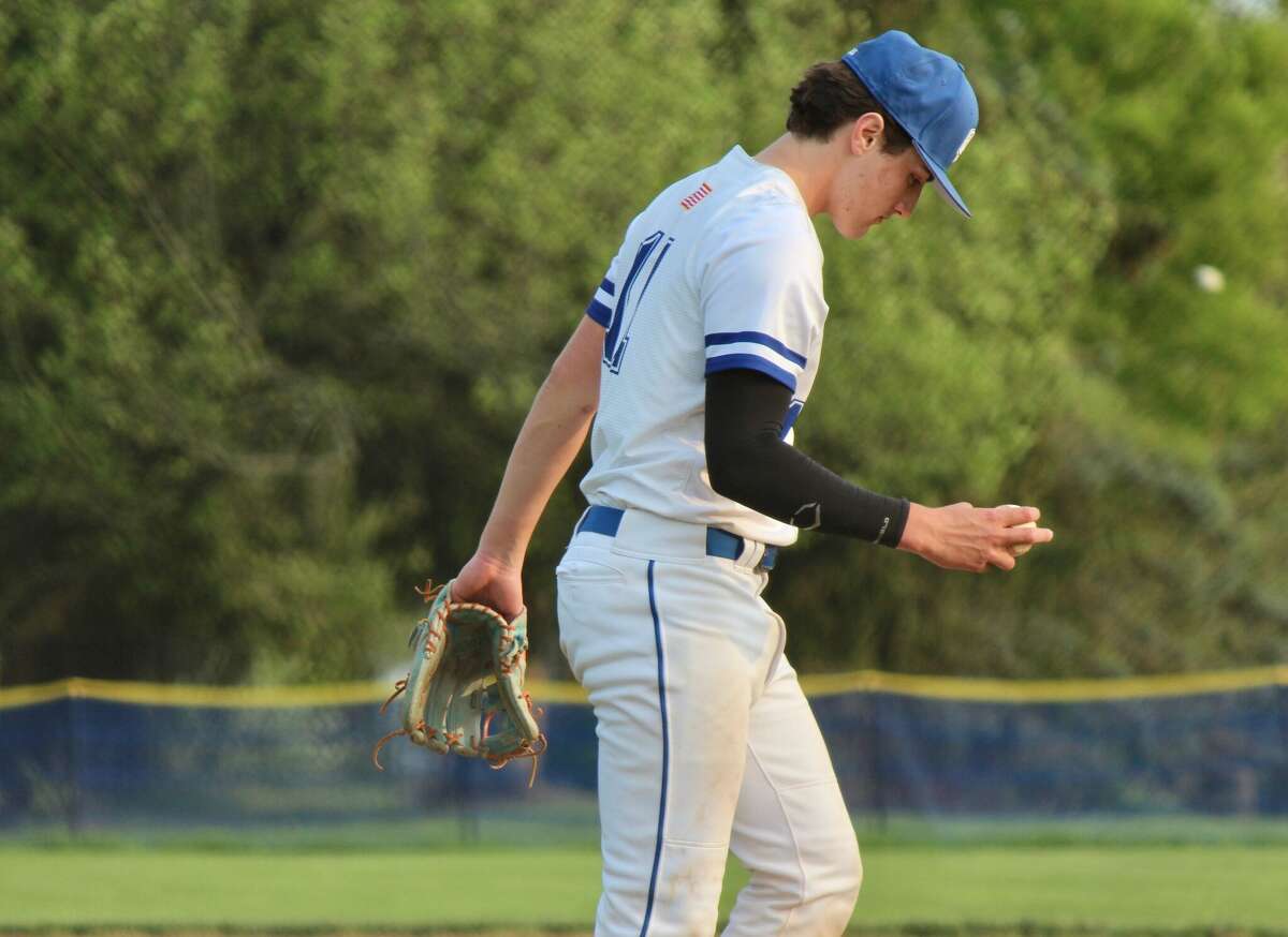 Old Saybrook's Connor Lane, a UConn commit, catches and pitches.
