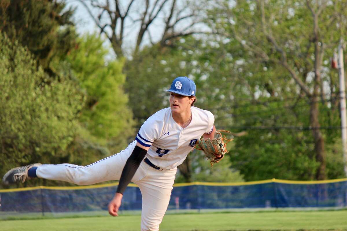 Old Saybrook's Connor Lane, a UConn commit, catches and pitches.