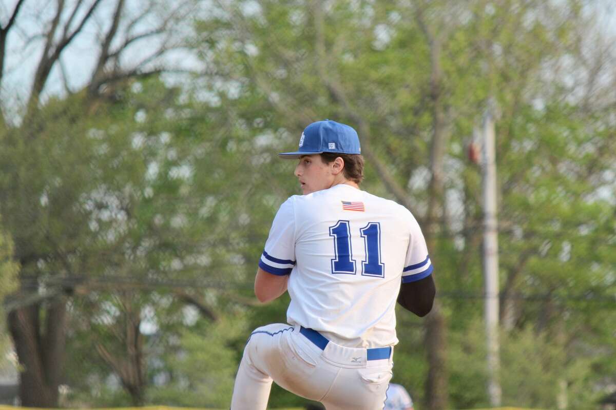 Old Saybrook's Connor Lane, a UConn commit, catches and pitches.