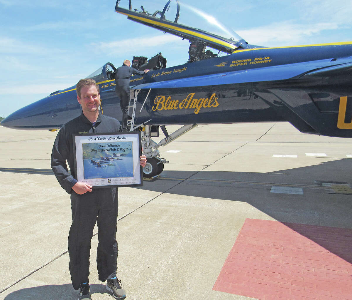 Collinsville principal Daniel Toberman flies with the Blue Angels