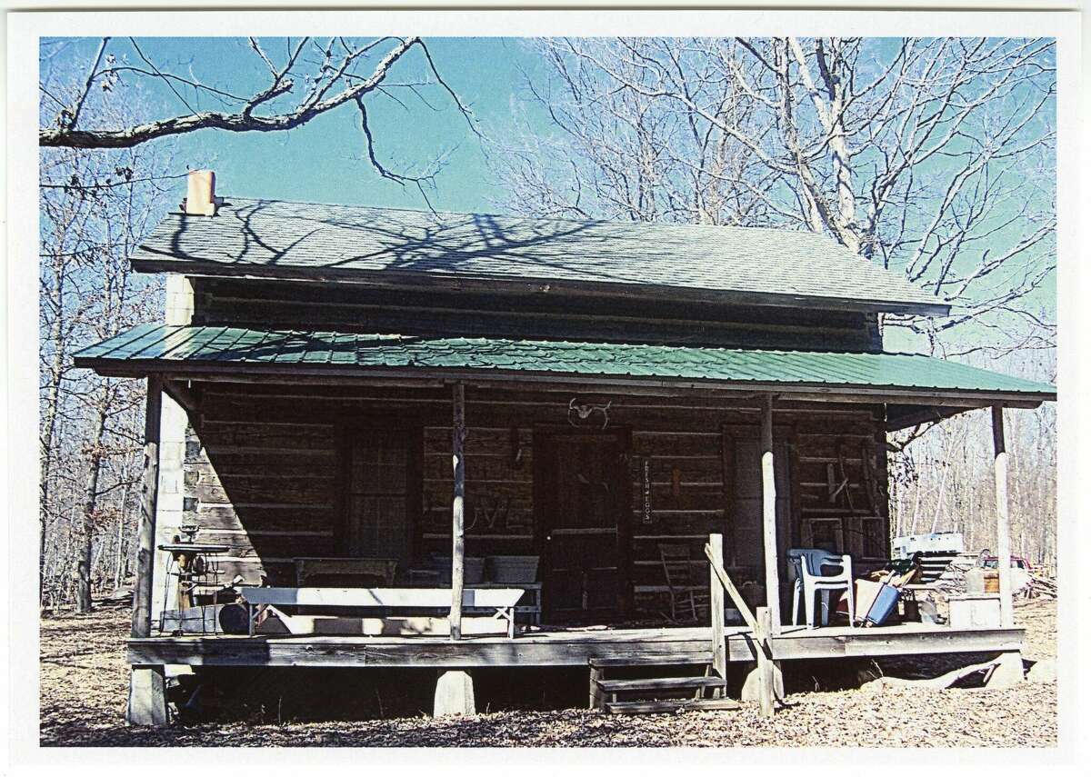 Floyd Andrick loves to explore log cabin homes in Midland County
