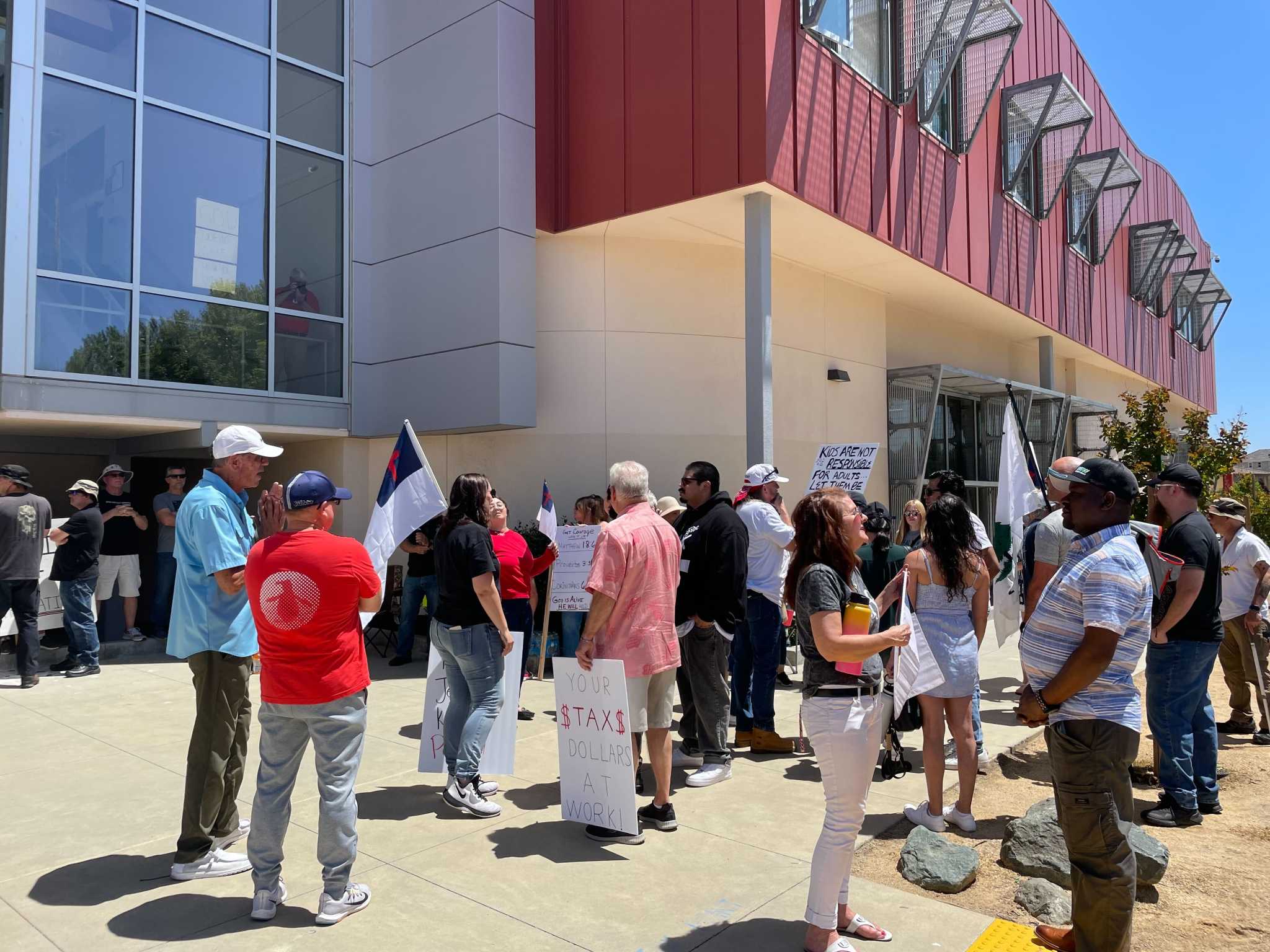 Protest against East Bay drag queen story time is tense but peaceful