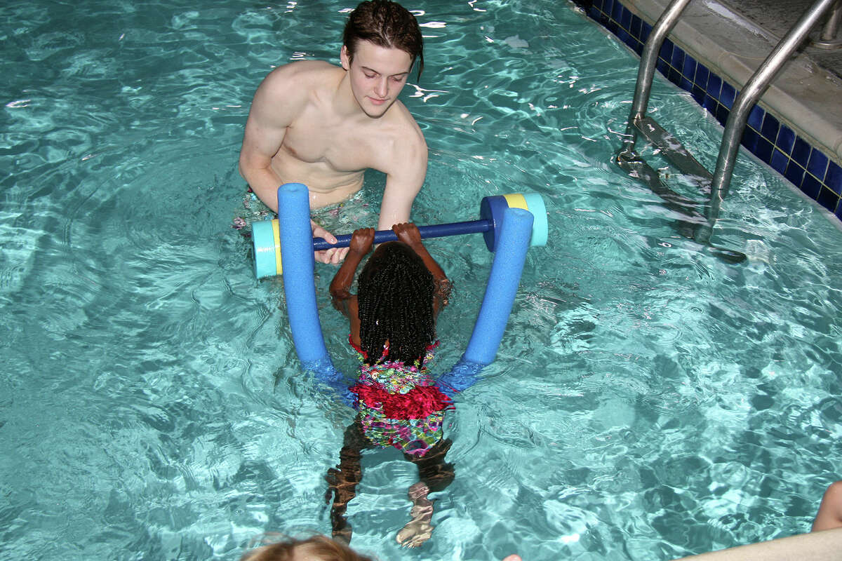 Olympic swimmers visit Edwardsville YMCA to enhance children's lessons