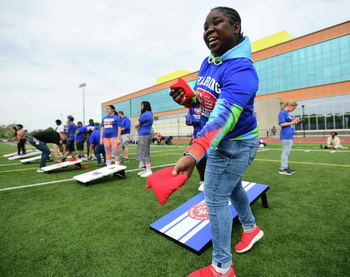 Pro wrestlers and CT students teamed up for cornhole tournament